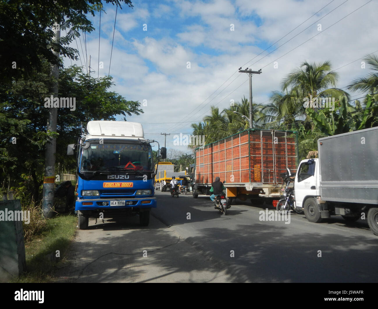This image depicts traffic congestion on Matimbubong Sapang Putol in ...