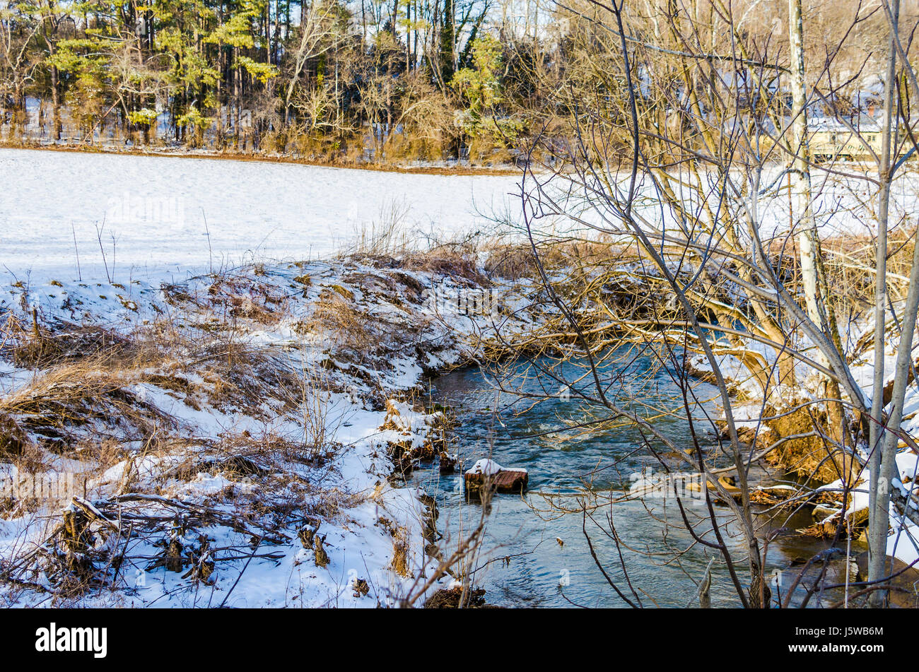 Flowing river in snow covered woods hi-res stock photography and images ...