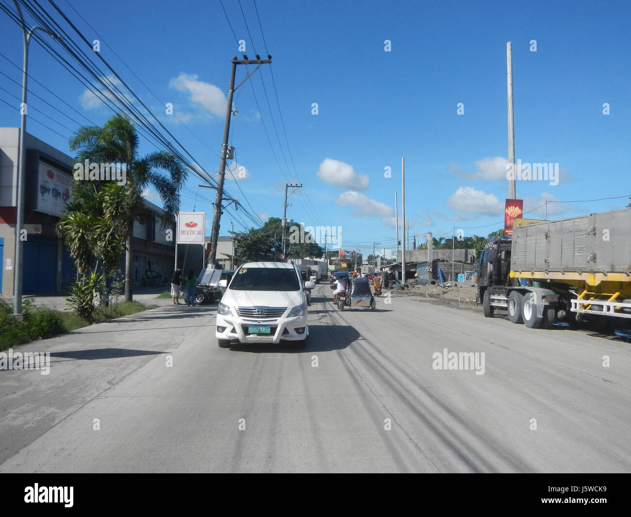 This photograph captures the Maharlika Highway at Santa Cruz Tabang ...