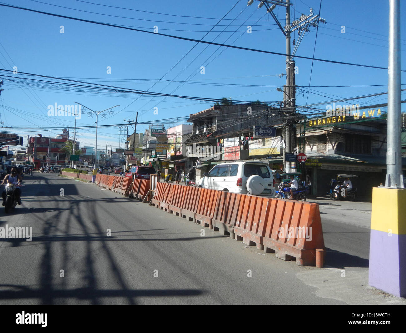 This image shows MacArthur Highway running through the towns of Bocaue ...