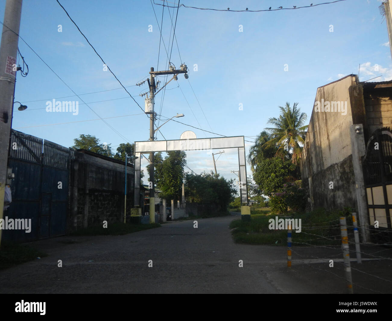 The image depicts the rural landscape of Barangay Bulacan, specifically ...