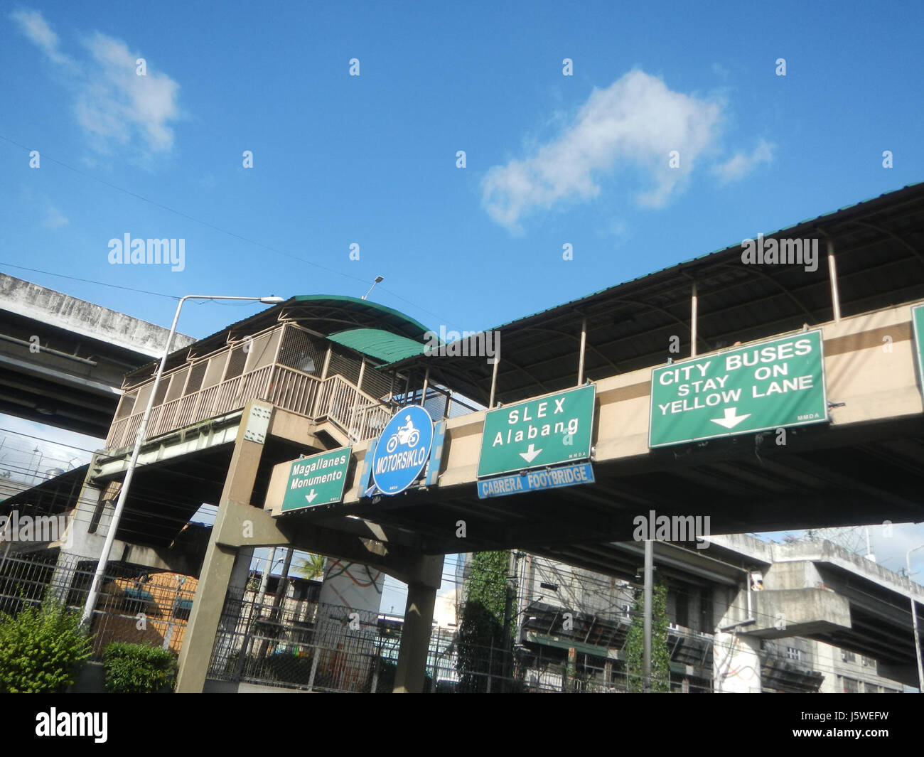 The image shows a footbridge and flyover at San Roque Cabrera Street in ...