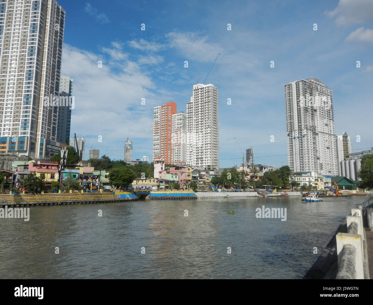 This image depicts the Pasig River Park Baywalk, located along J. P ...