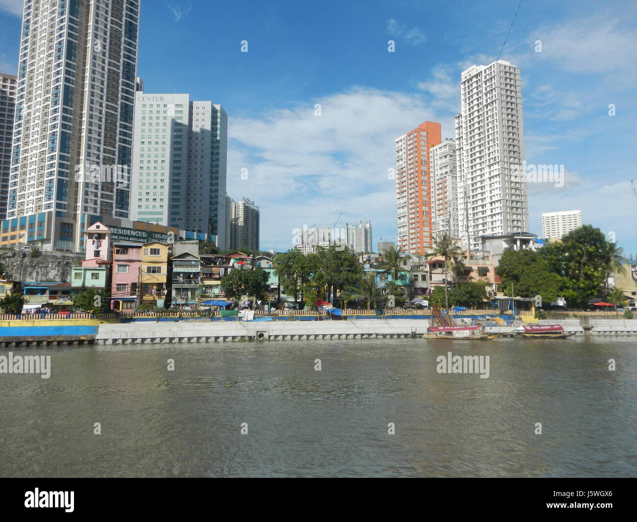 This image captures a view of the Pasig River Park and Baywalk area ...