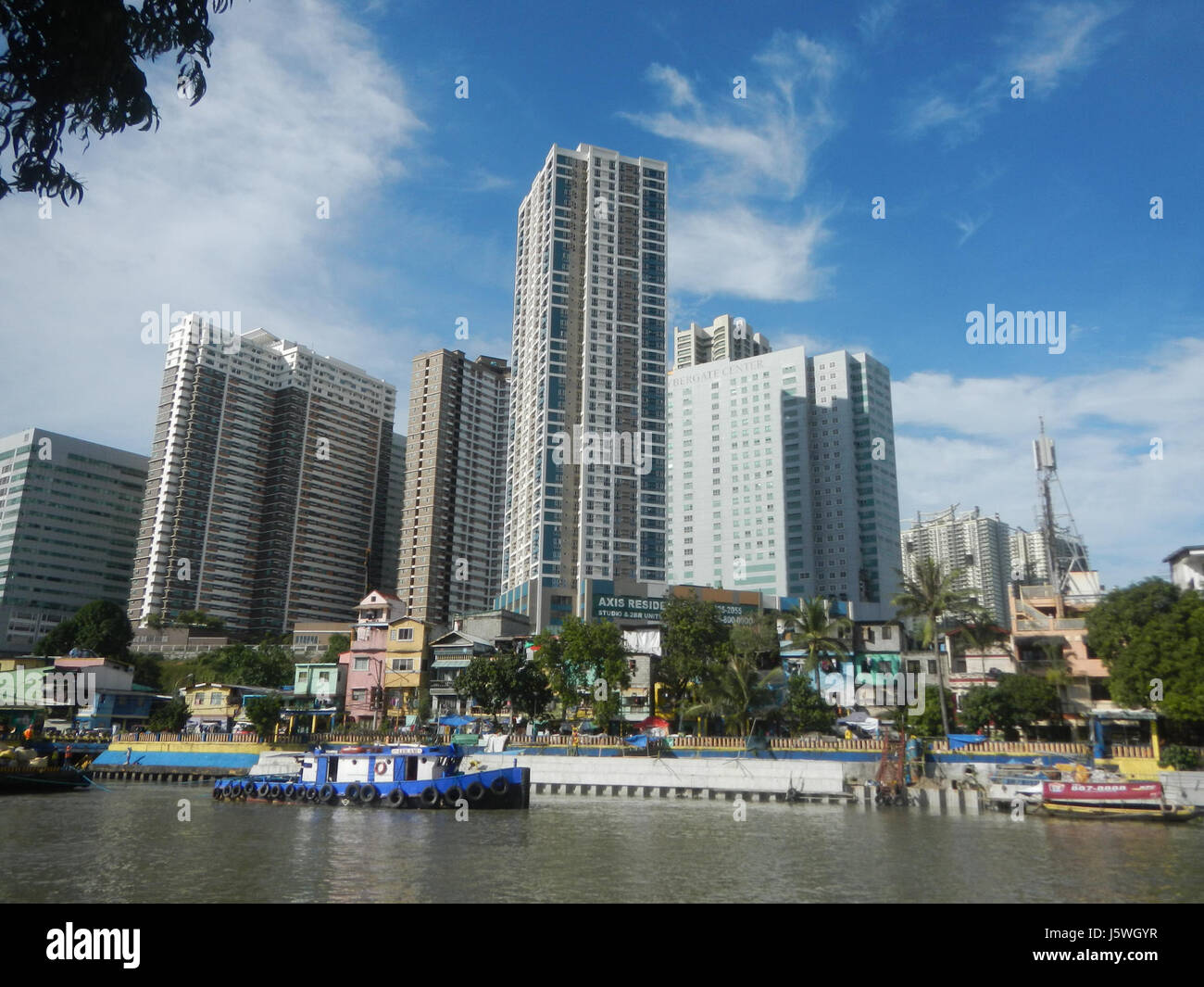 This image depicts the Pasig River Park Baywalk, a popular waterfront ...