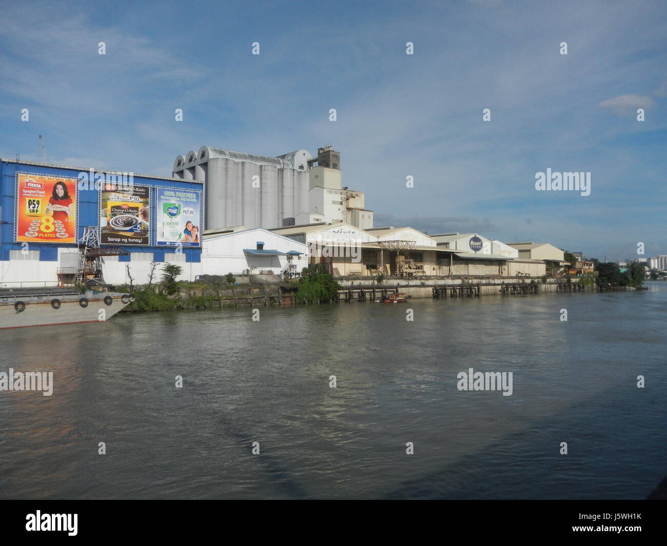 The image shows a section of the Pasig River Park along Baywalk in ...