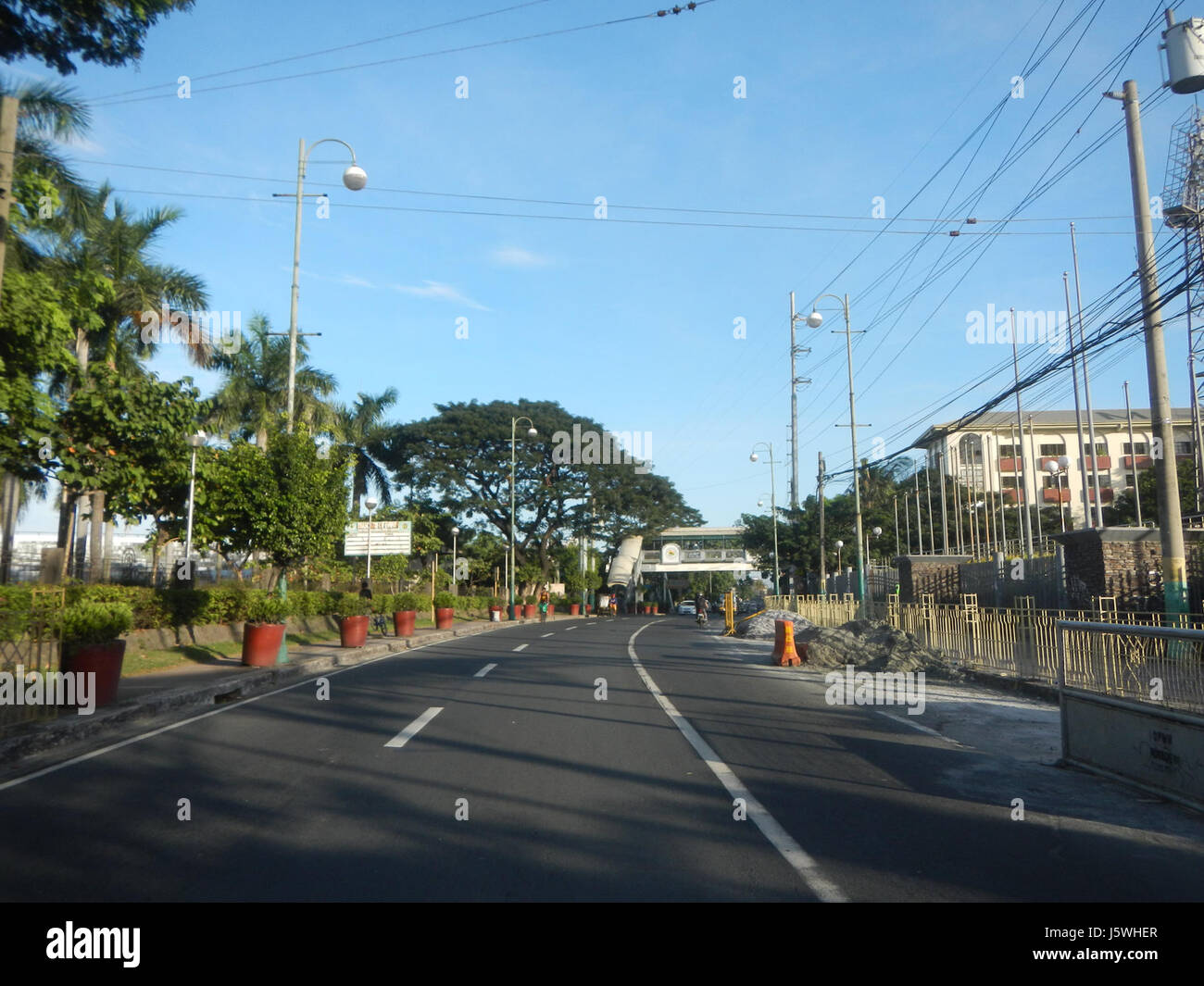 A view of old trees and footbridges in the Makati Park Garden located ...