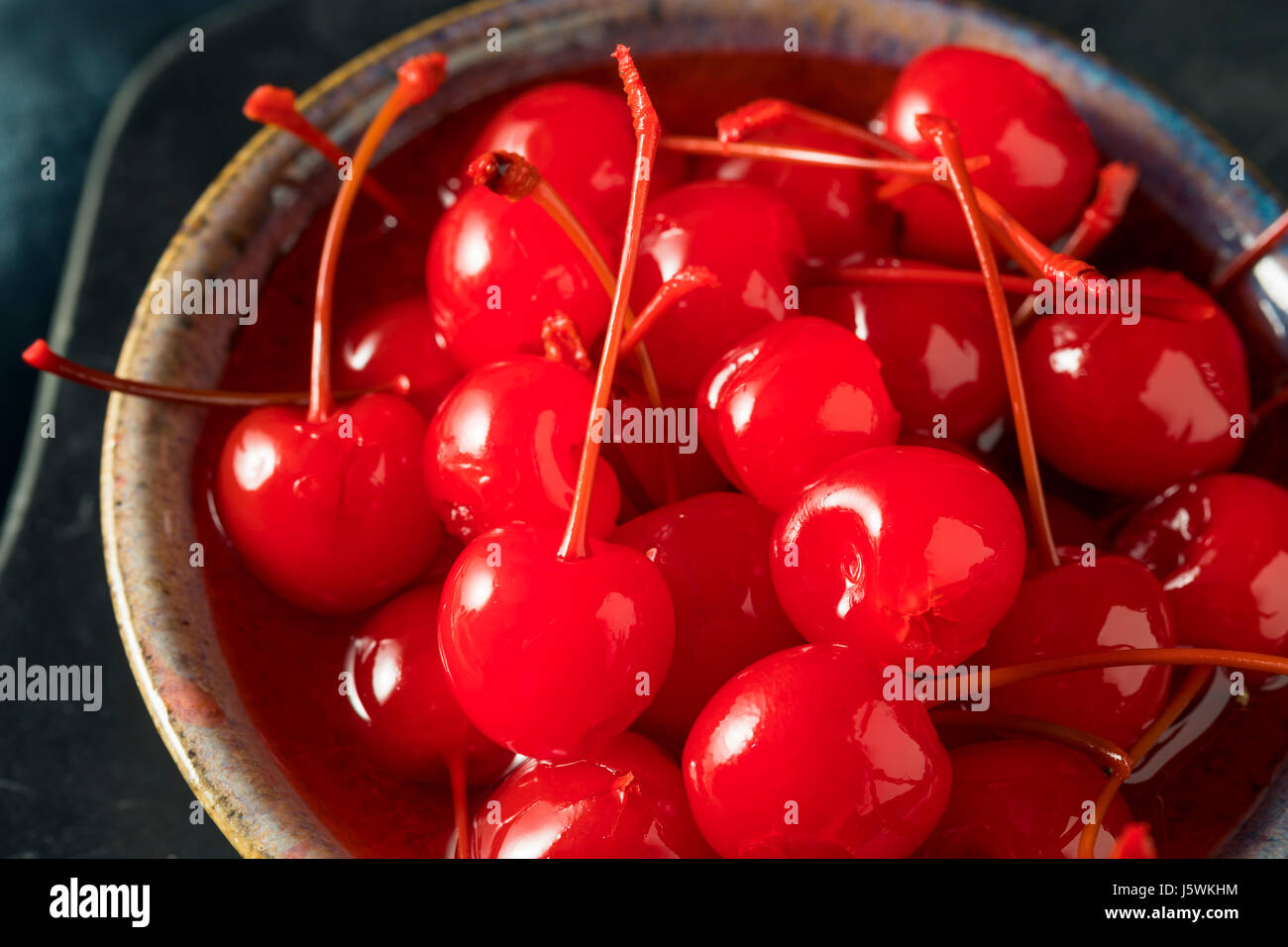 Sweet Red Maraschino Cherries in Sticky Syrup Stock Photo - Alamy