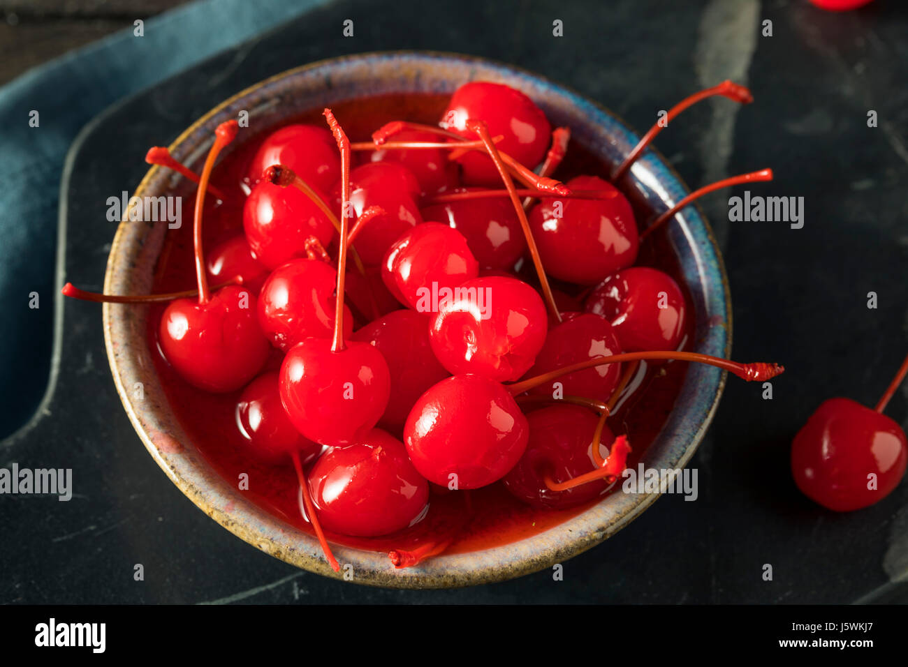 Sweet Red Maraschino Cherries in Sticky Syrup Stock Photo - Alamy