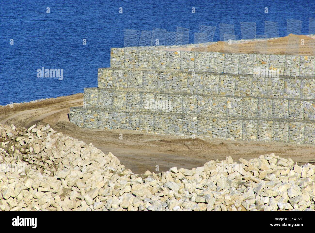 stone rock wall granite construction site stone rock wall basket gravel ...