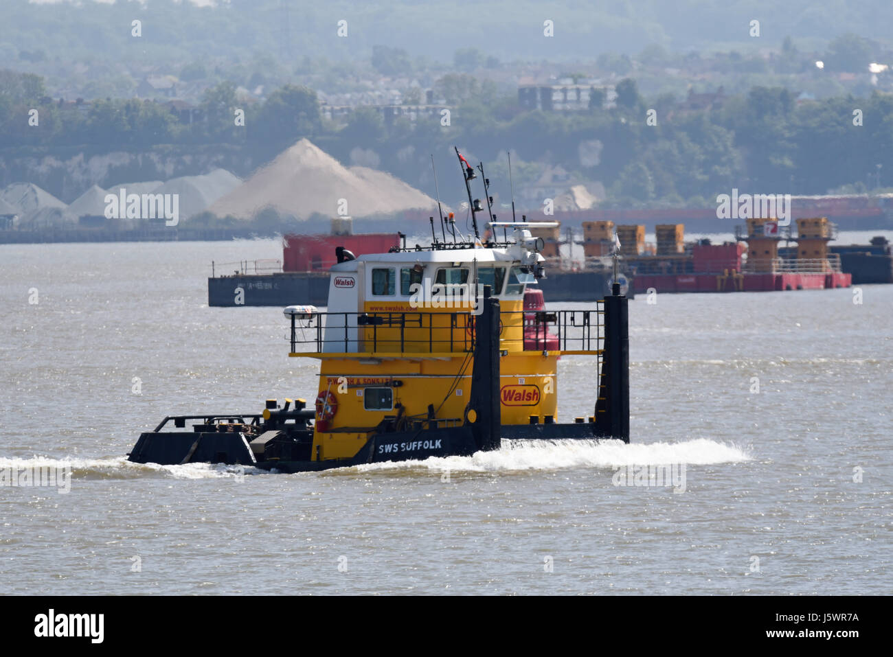 A tug operating near Tilbury Docks on the River Thames in Essex, UK ...