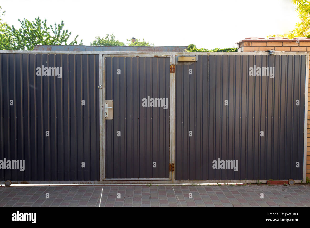 Iron gate of gray color Stock Photo - Alamy