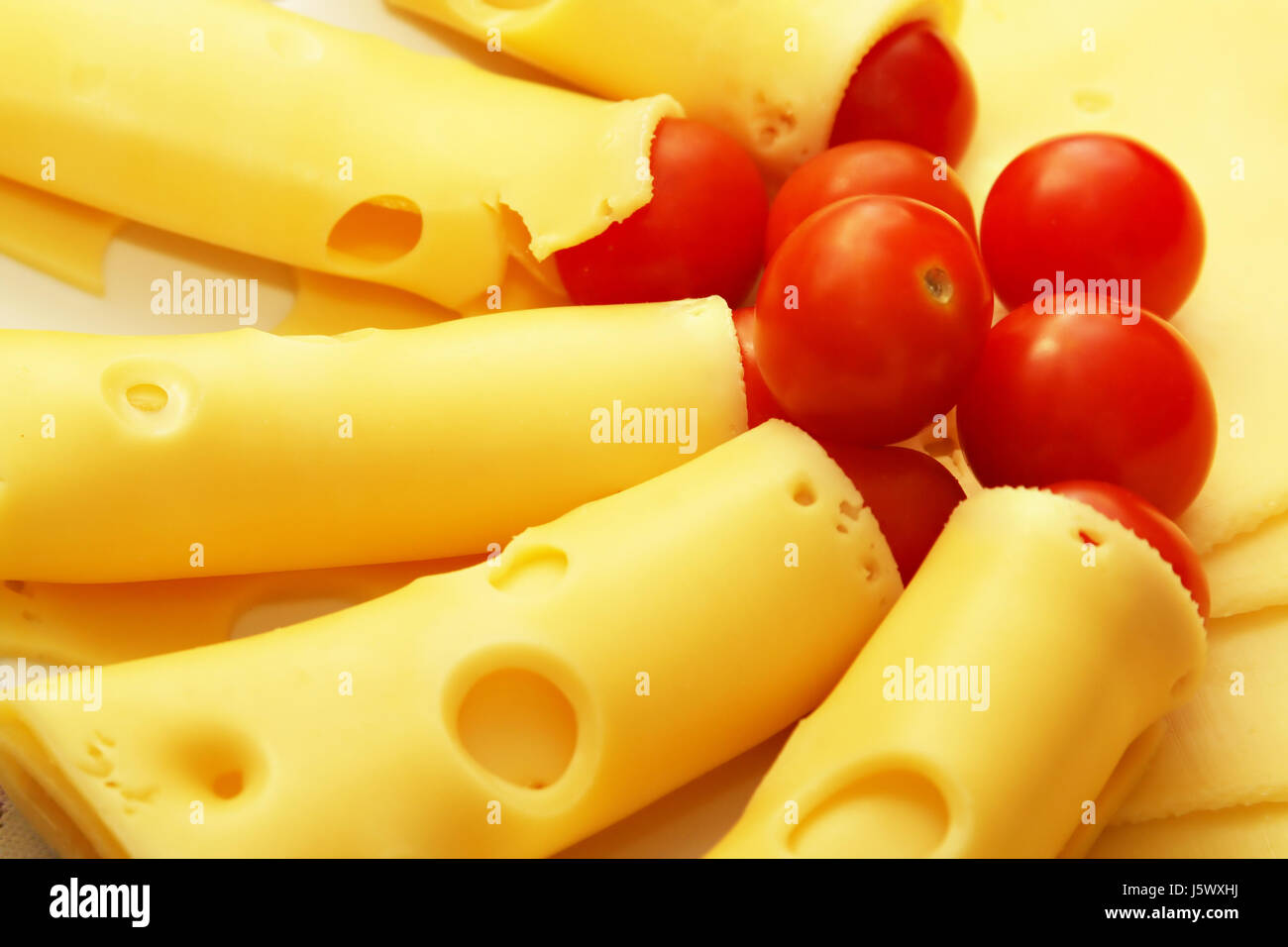 disc cheese red tomato yellow cold disc cheese sideboard milk product ...