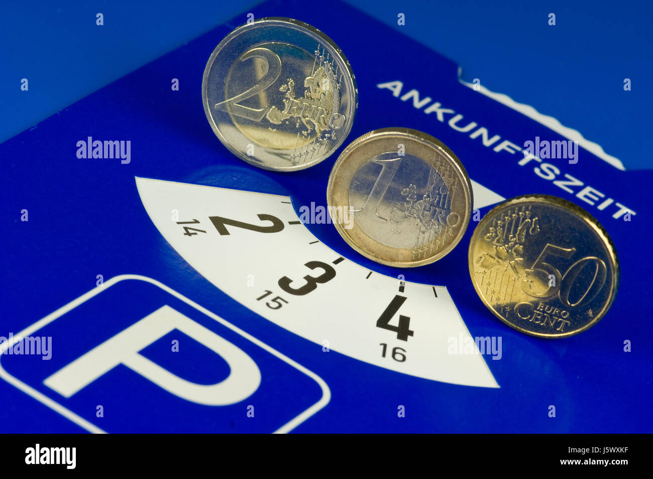parking disc with coins Stock Photo - Alamy