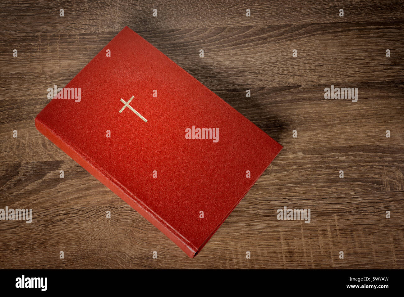 Red bible with cross on cover Stock Photo - Alamy