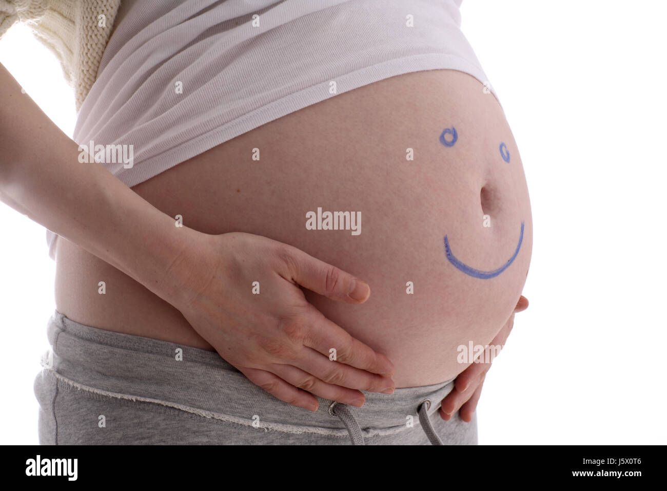 Pregnant woman drawing smiley face hi-res stock photography and images ...