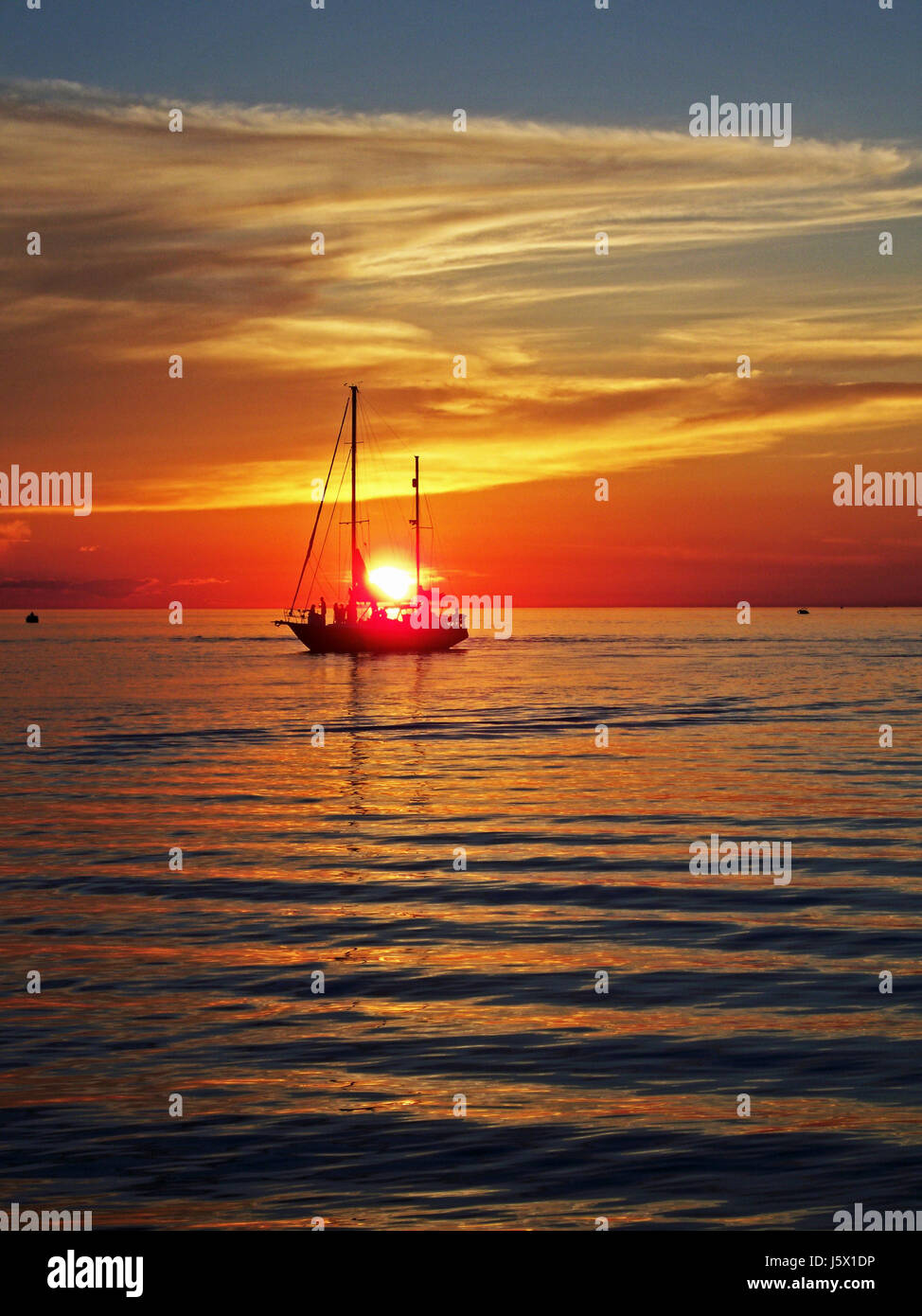 Sailboat at sunset hi-res stock photography and images - Alamy