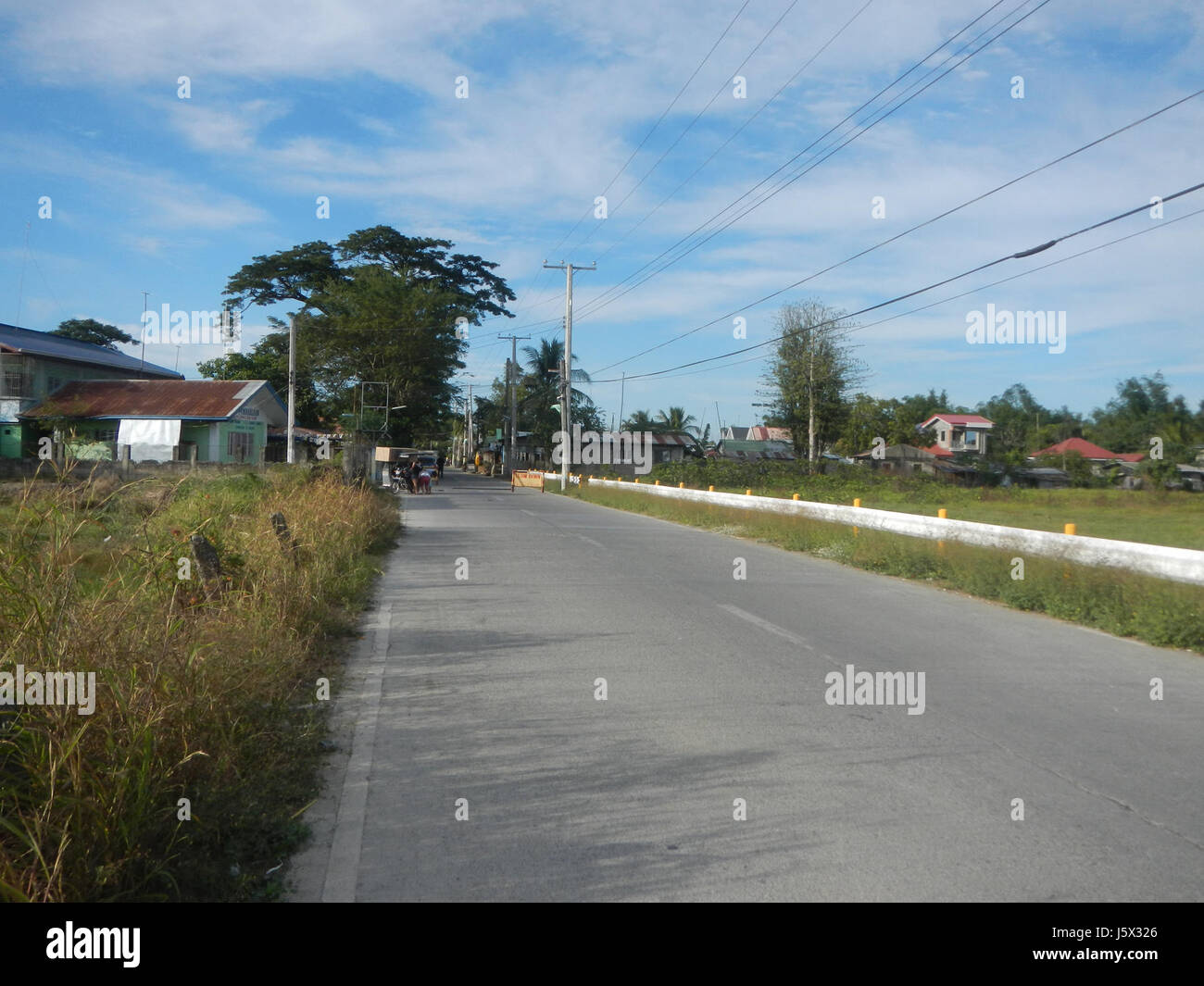 This photograph captures the paddy fields and grasslands of Sumacab Sur ...