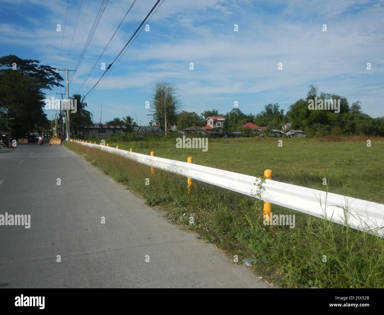 A photograph of the paddy fields and grasslands in Sumacab Sur Norte ...