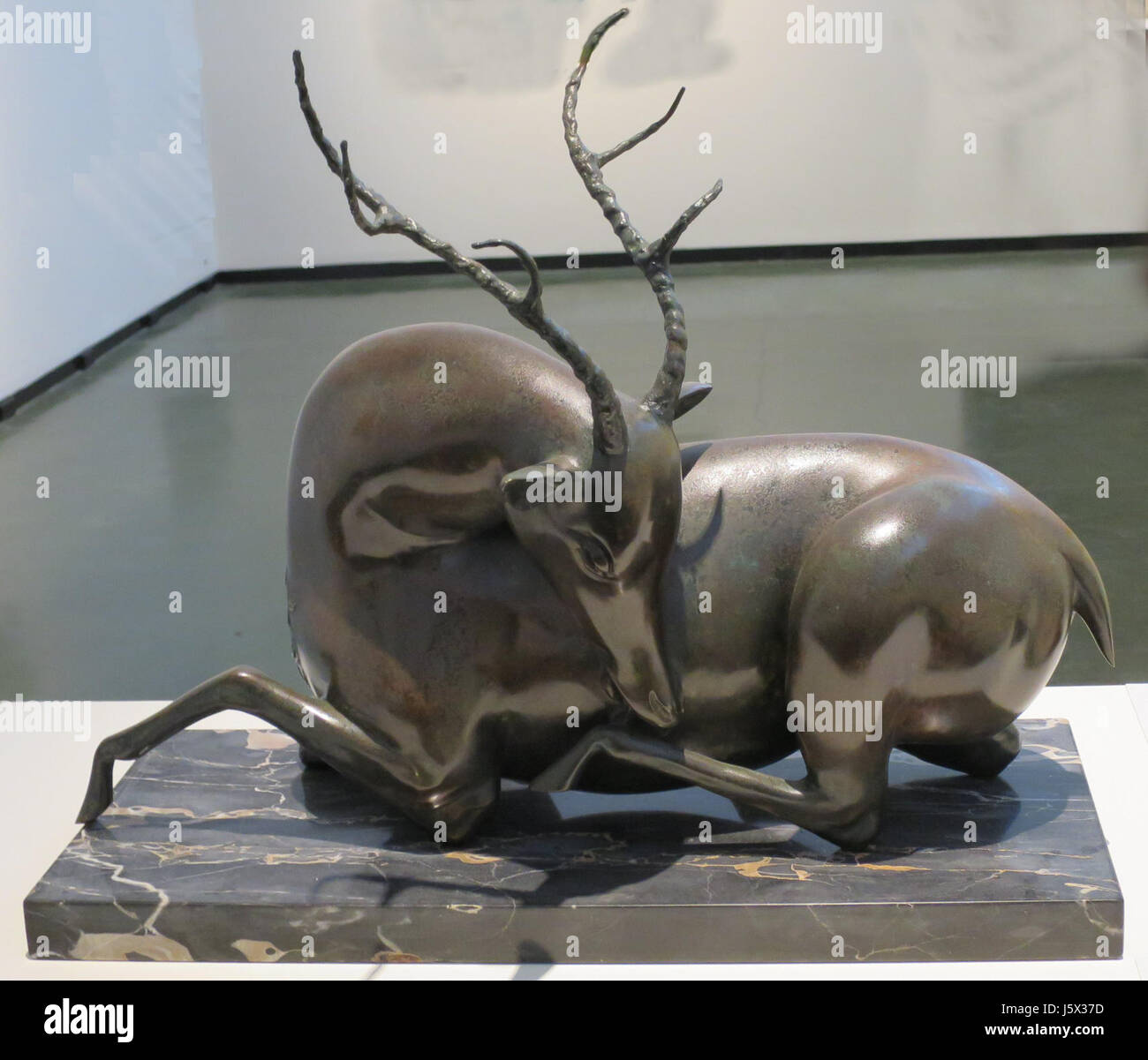 'Resting Stag' is a sculpture by Elie Nadelman, housed at the Honolulu ...