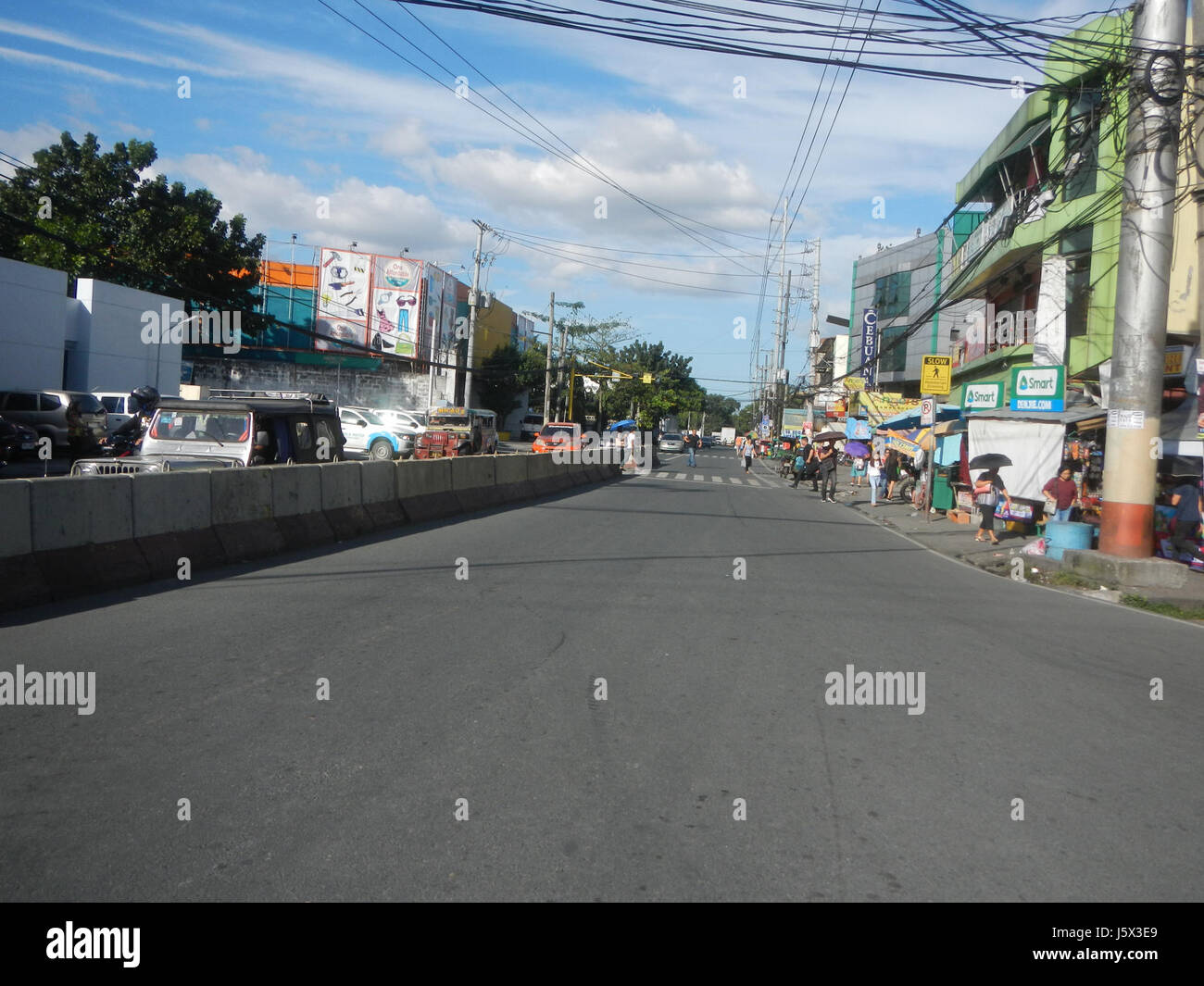This location in Pasig City, Philippines, features pedestrian footbridges along Ortigas Avenue ...