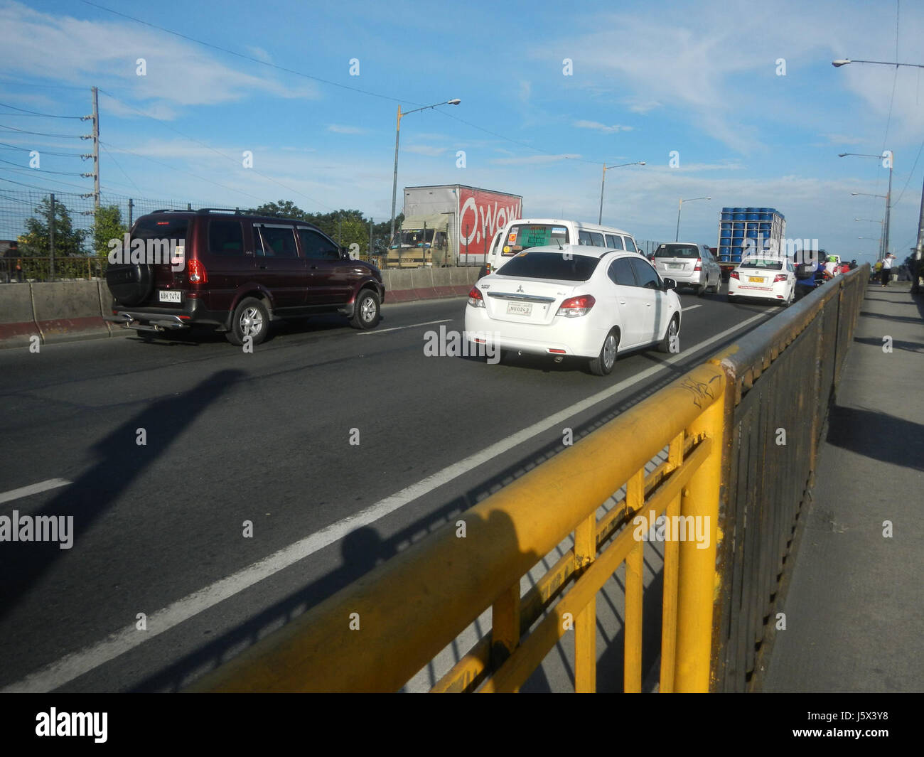 This image shows the Ortigas Avenue Extension in Pasig City, Manila ...