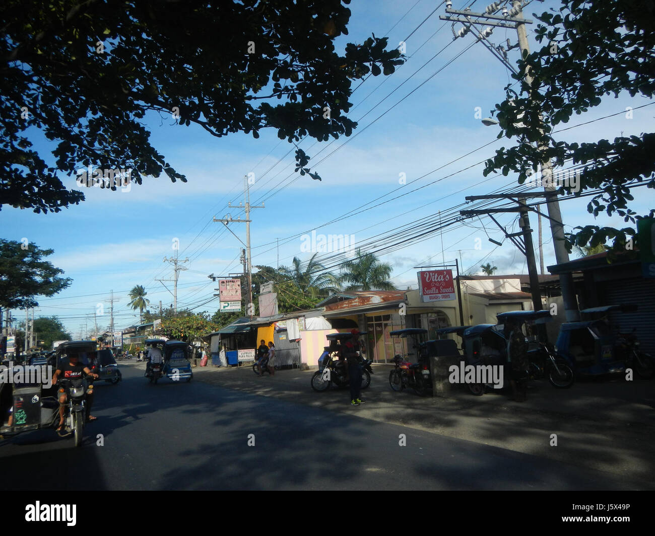 This image depicts a rural area along the Maharlika Highway in Bulacan ...