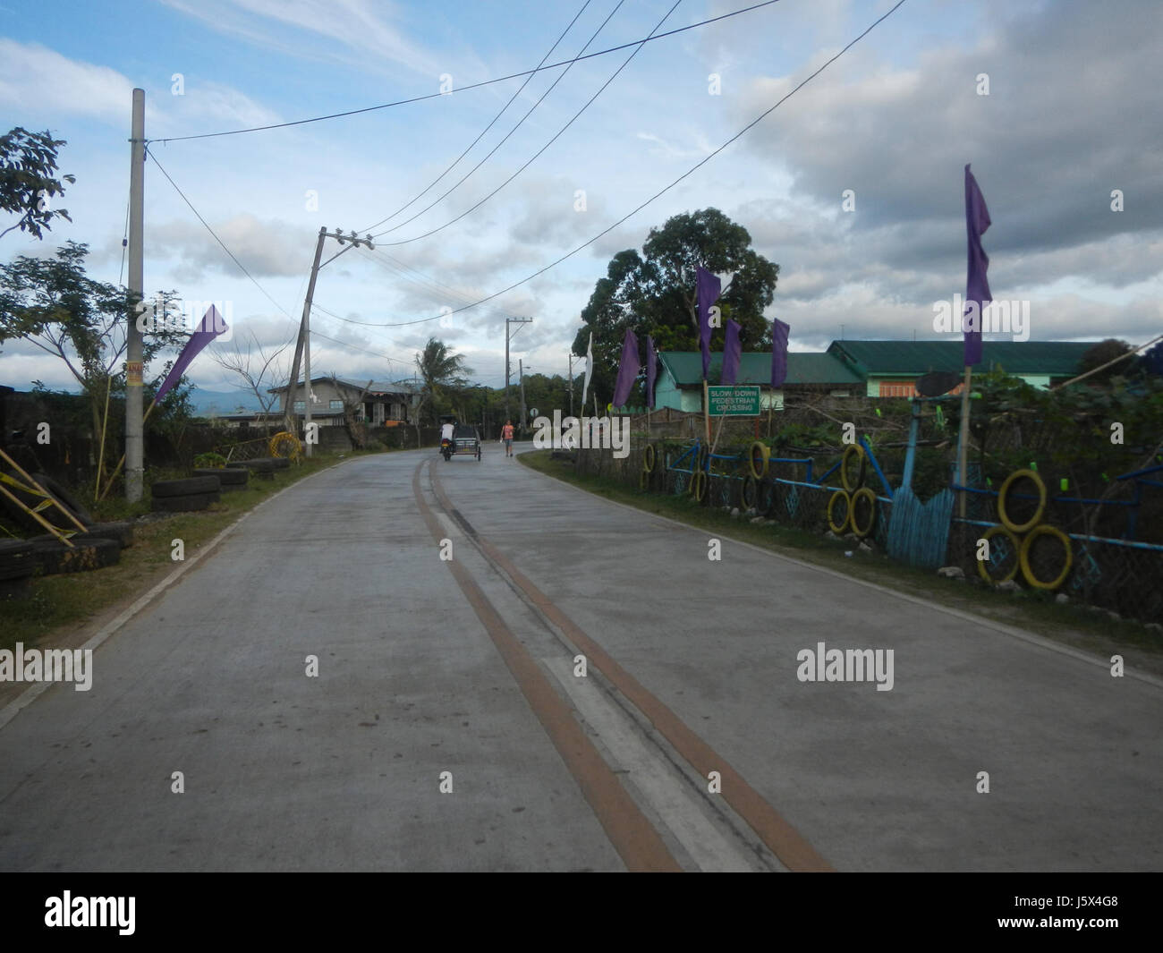 This photograph depicts the provincial road connecting various towns in ...