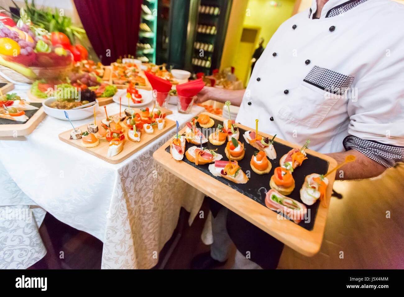 View at chef serving food in restaurant Stock Photo - Alamy