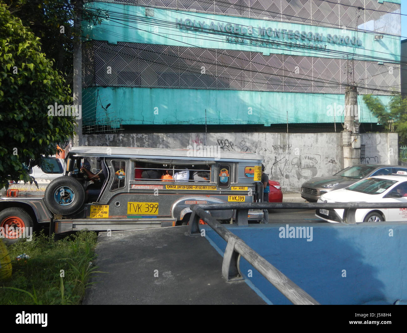 This image shows the bustling streets and areas in Quezon City ...