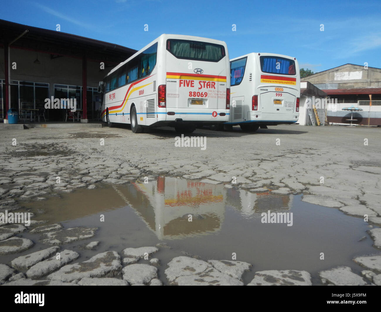 This photograph captures Five Star and Cisco buses at a bus stop in San ...