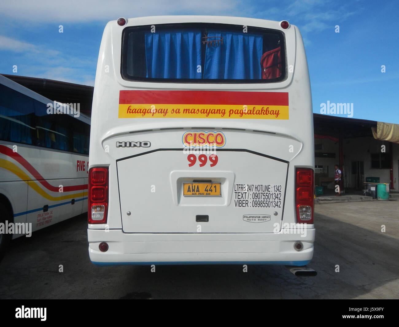 The image shows Five Star and Cisco buses at a bus stop in San Miguel ...
