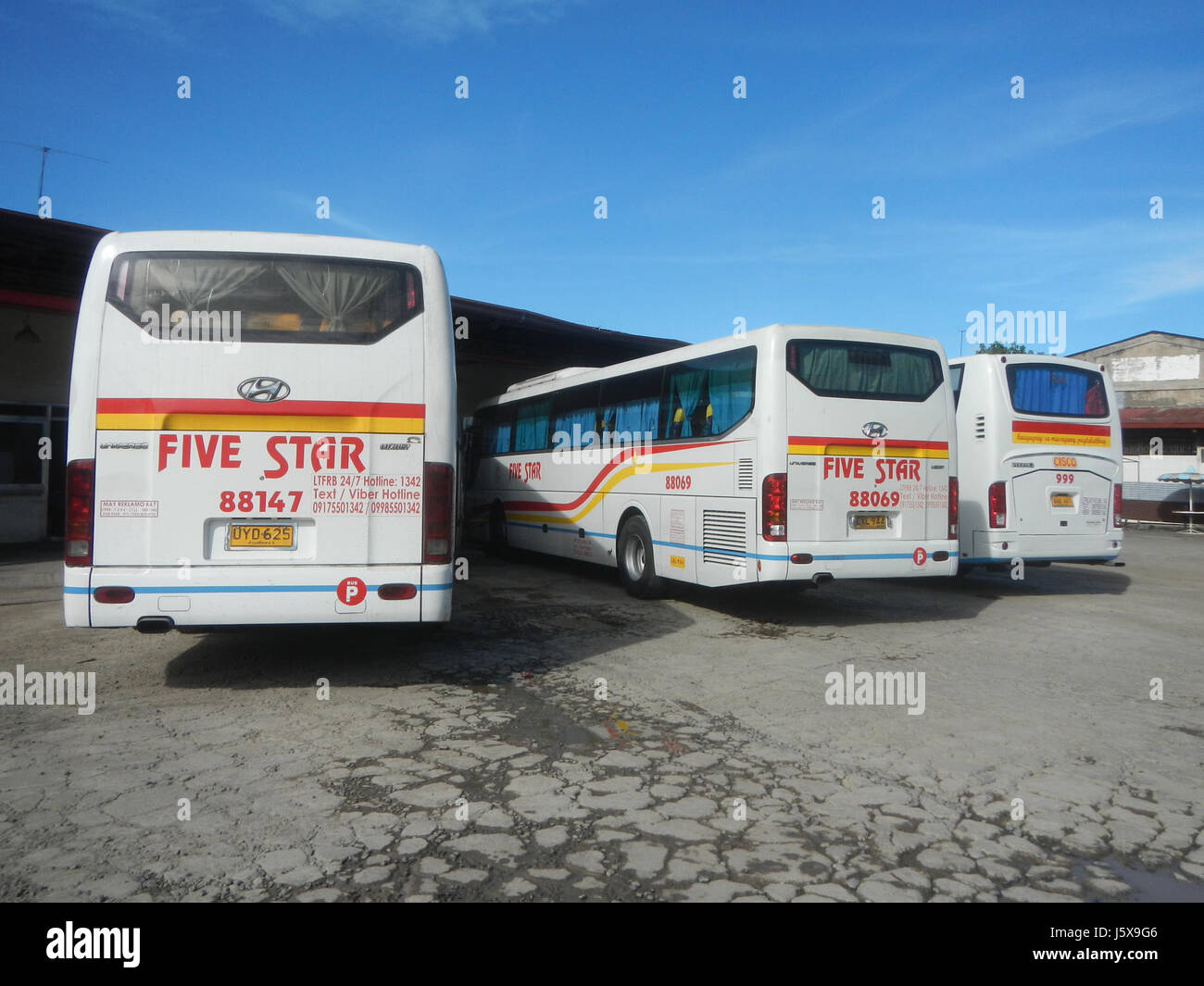 This image depicts Five Star and Cisco buses at a bus stop in San ...