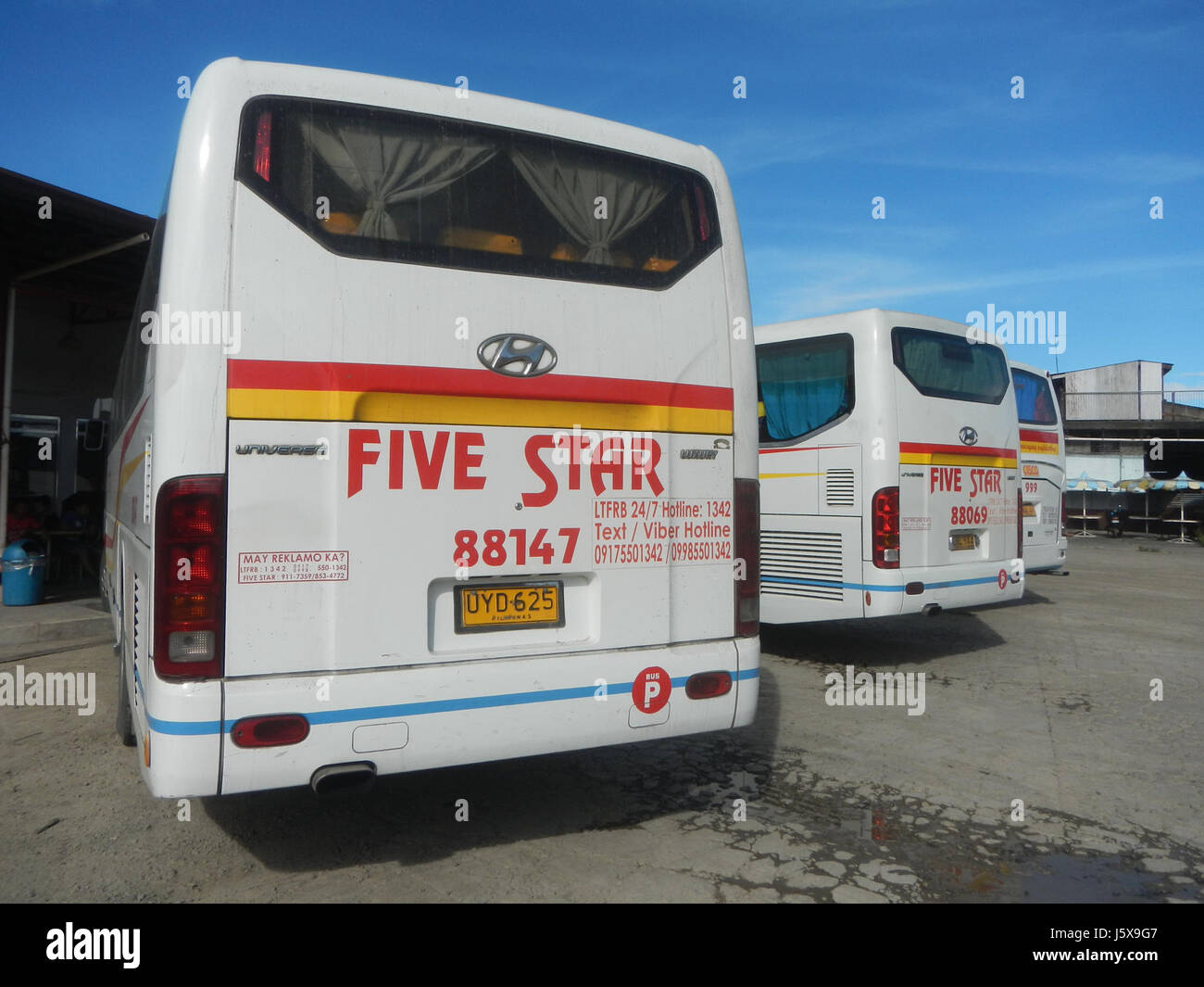 This image depicts Five Star and Cisco buses at a bus stop in San ...