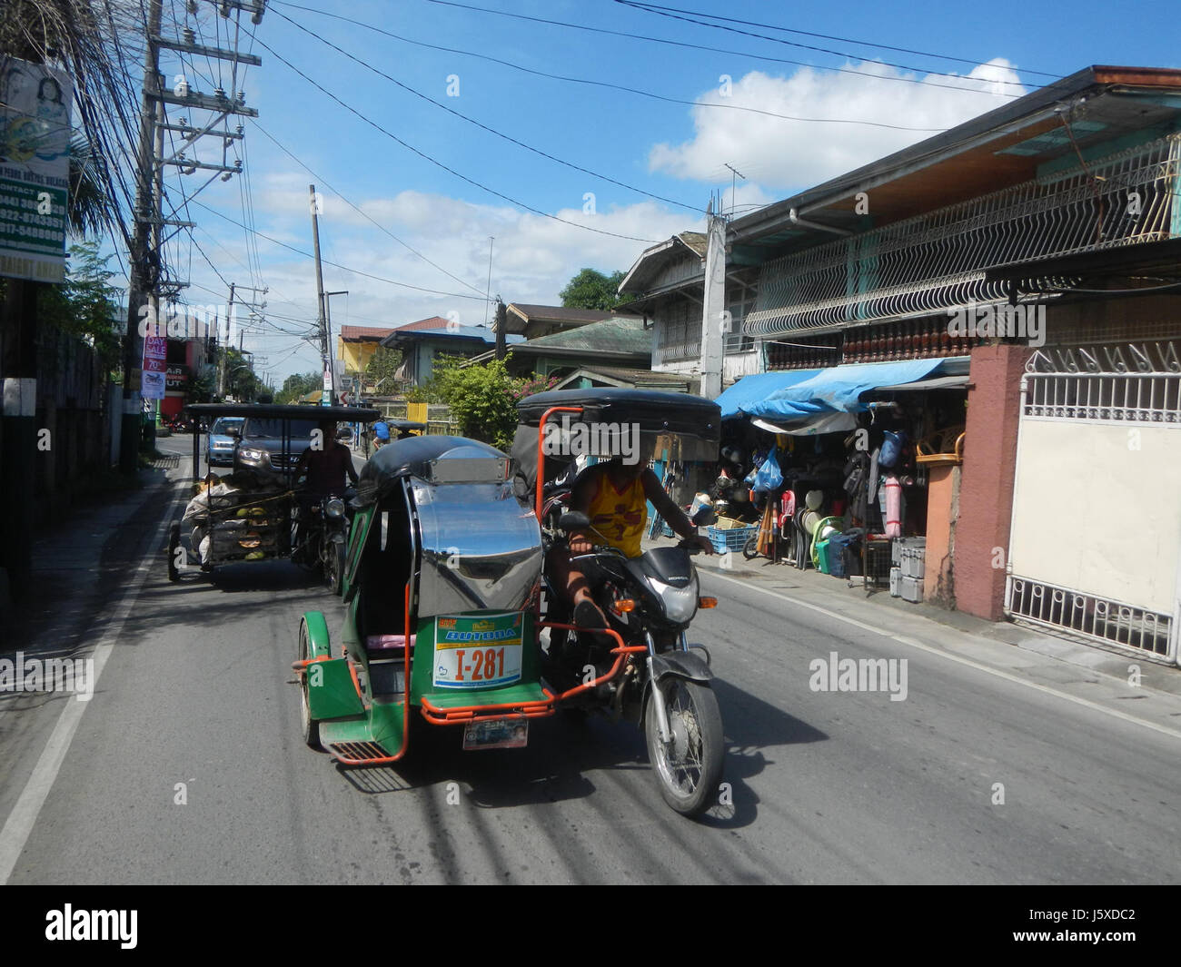 This image depicts a street scene in Poblacion, Tanauan, Bustos ...