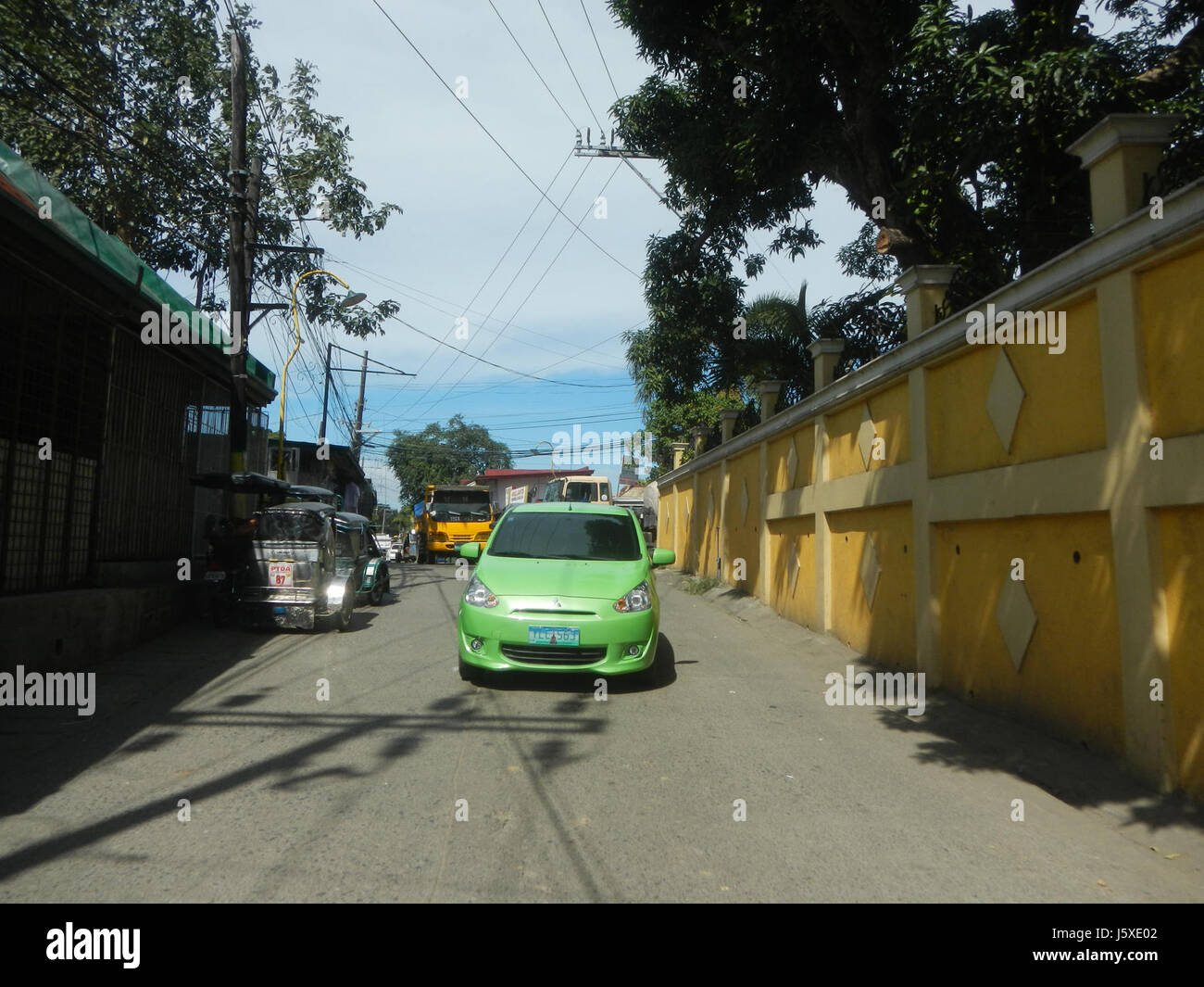 This road in Pandi, Bulacan, connects the communities of Poblacion San ...