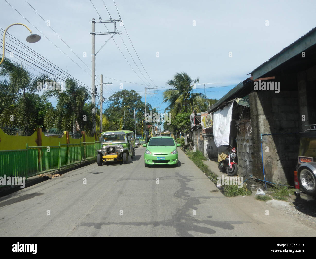 This photograph captures the road scene in Poblacion San Roque, Bagong ...