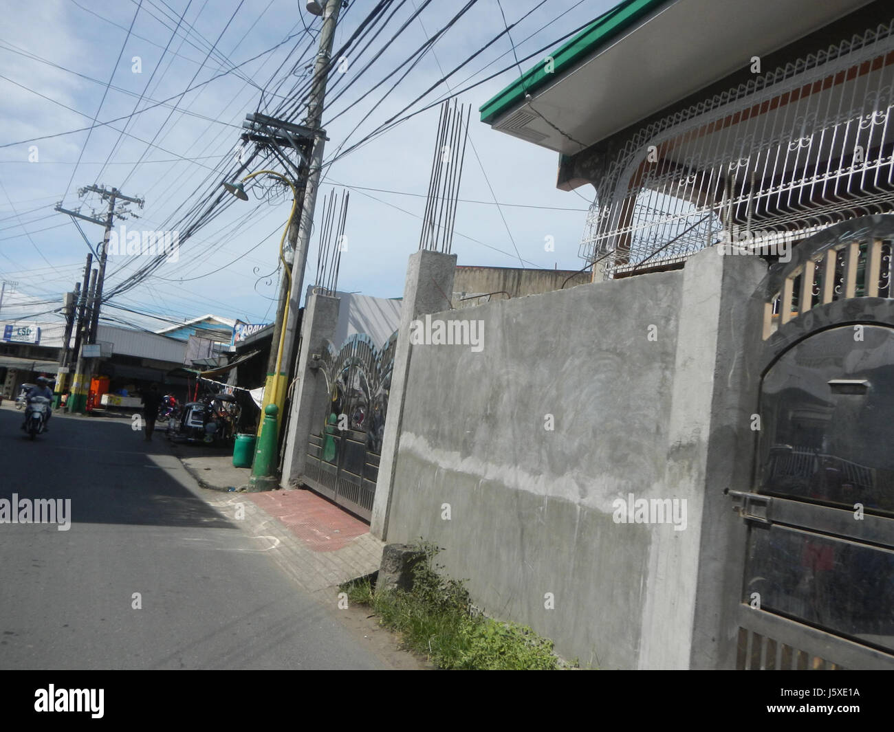 This image captures the development of road construction in Poblacion ...