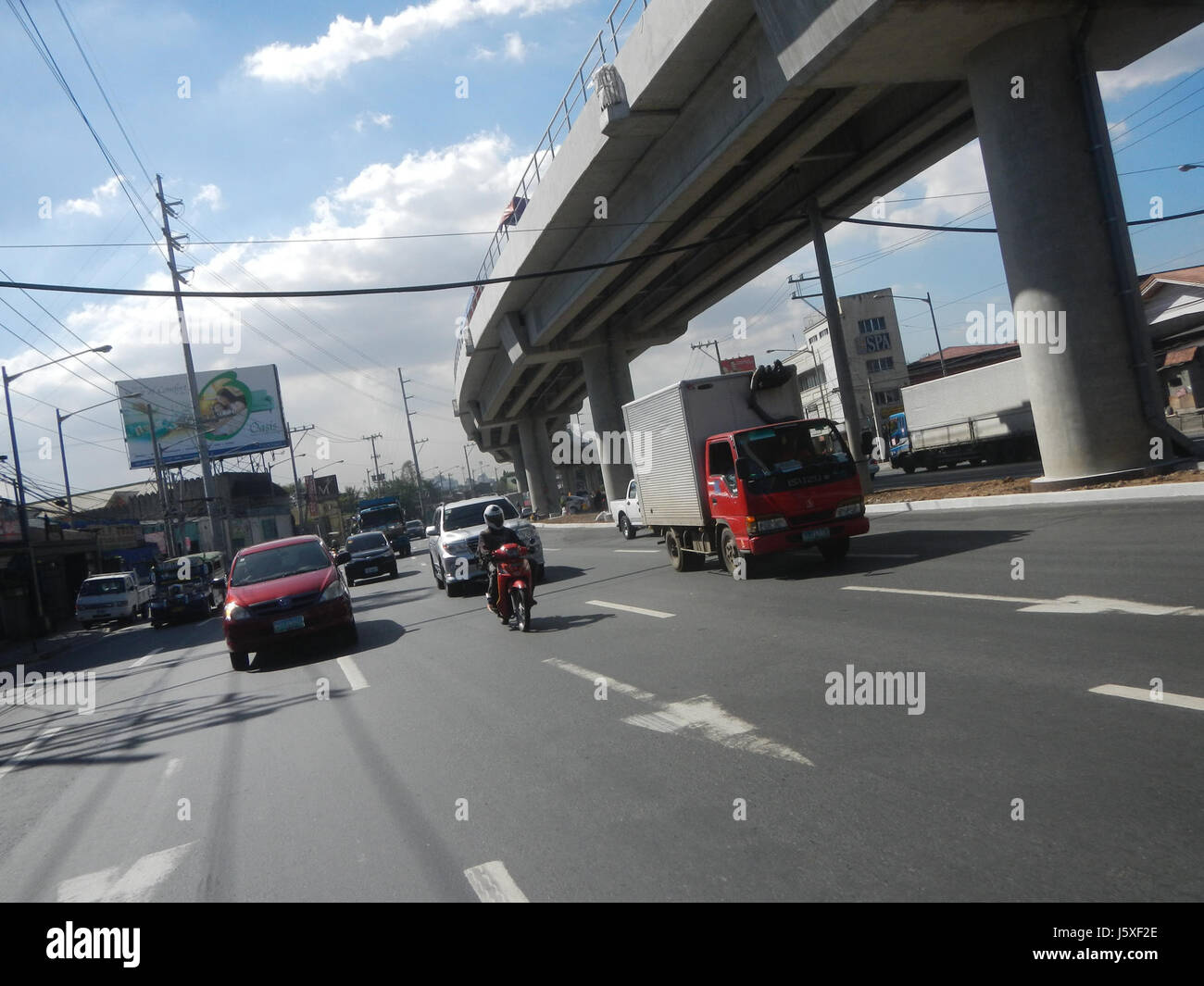 This image depicts the construction of the Manila MRT Line 3, focusing ...