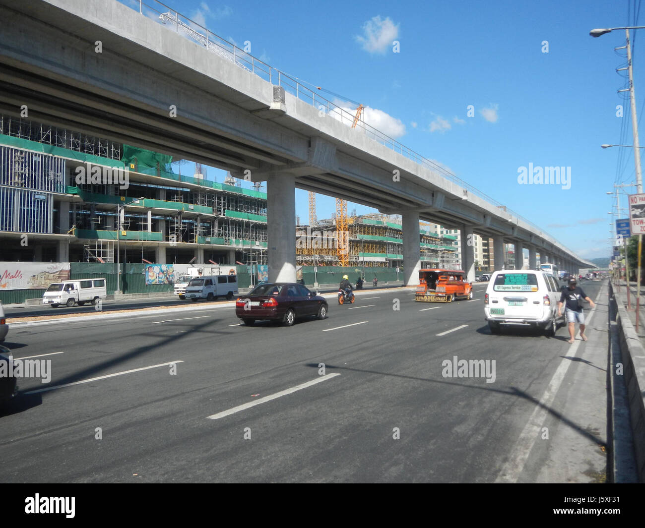 This image depicts the ongoing construction of the Manila MRT Line 15 ...