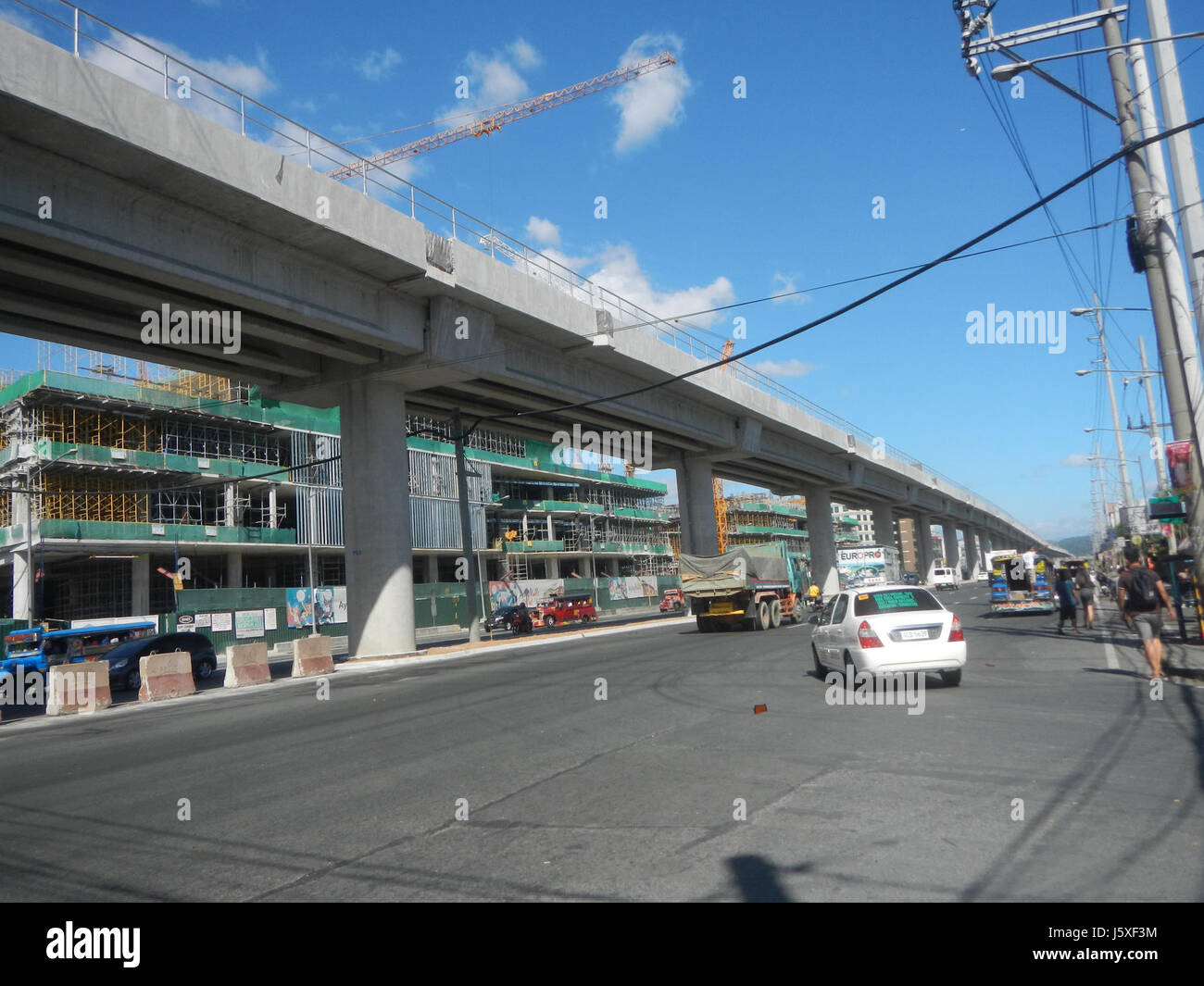 This image depicts the construction of the Manila MRT Line 3, including ...