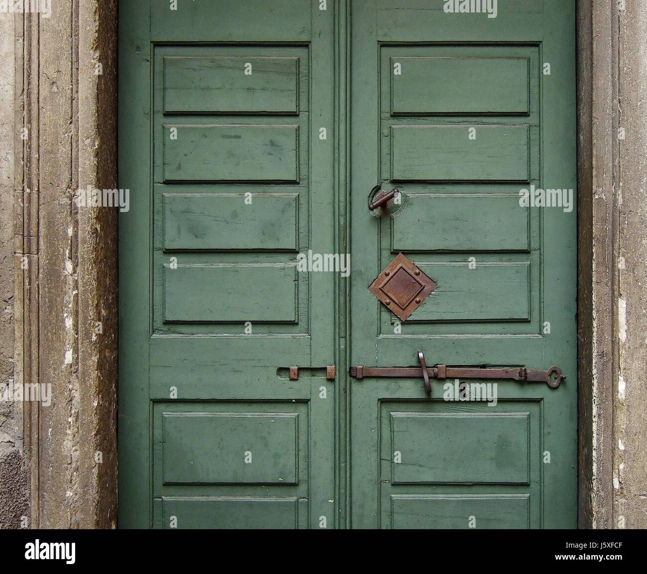 house building green entrance door barred bolt house building stone ...