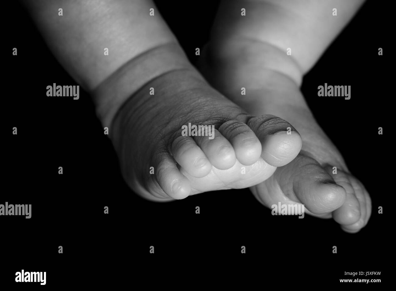 black swarthy jetblack deep black baby foot child hand hands finger ...