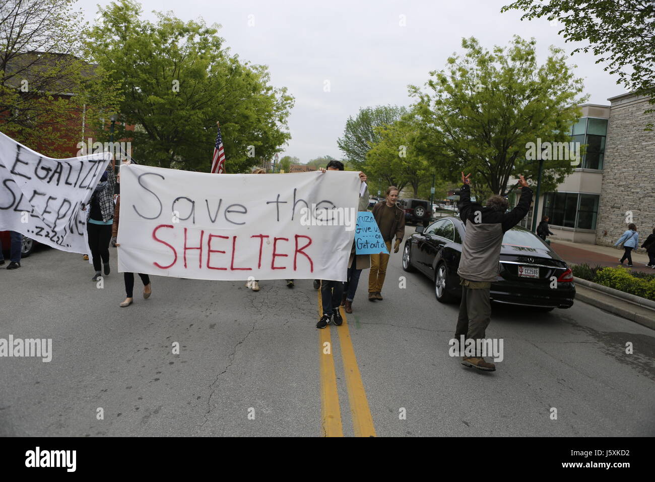Activists march and protest for the rights of people experiencing ...
