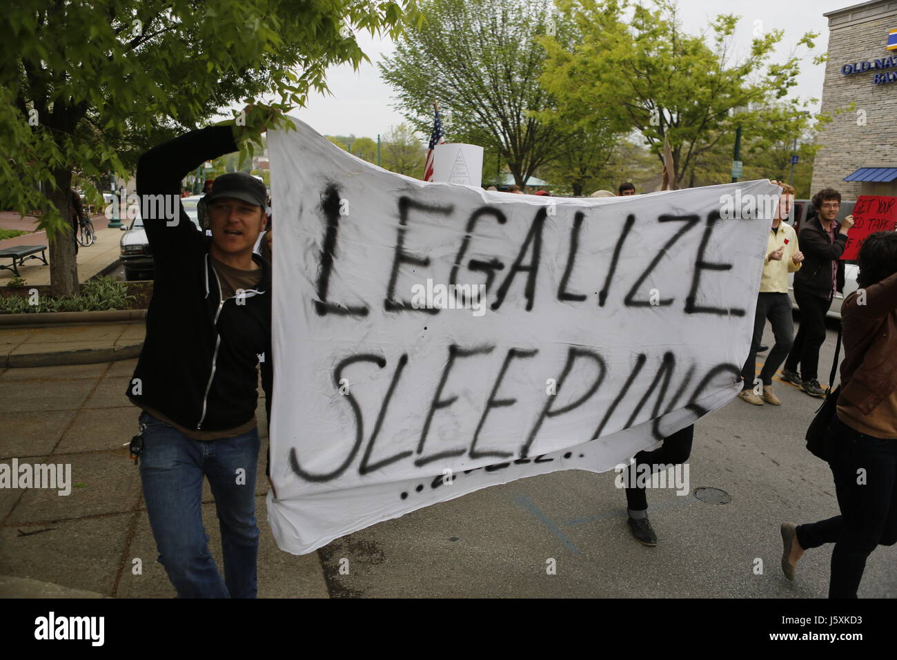 Activists march and protest for the rights of people experiencing ...