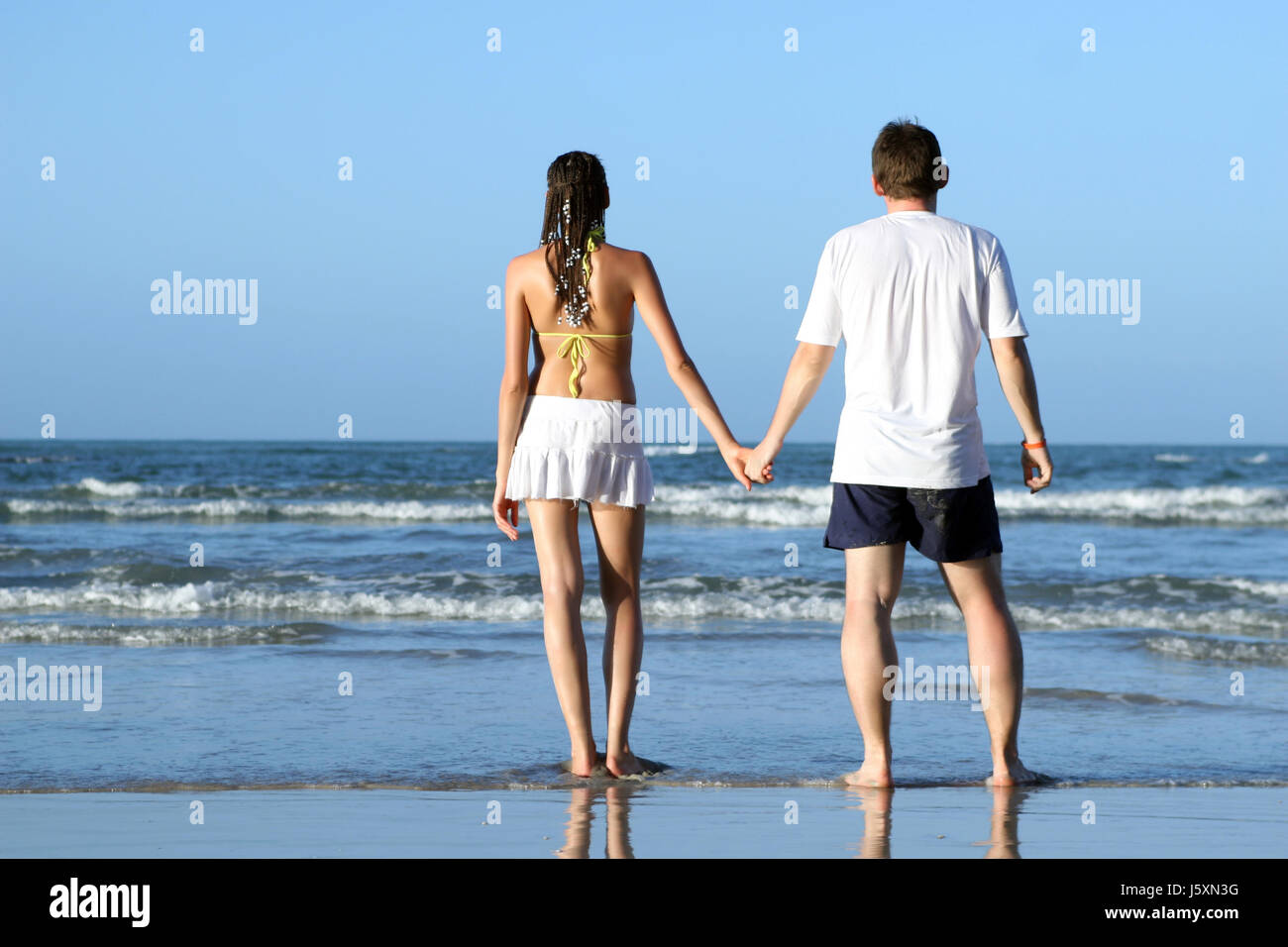 hand in hand on the beach Stock Photo - Alamy