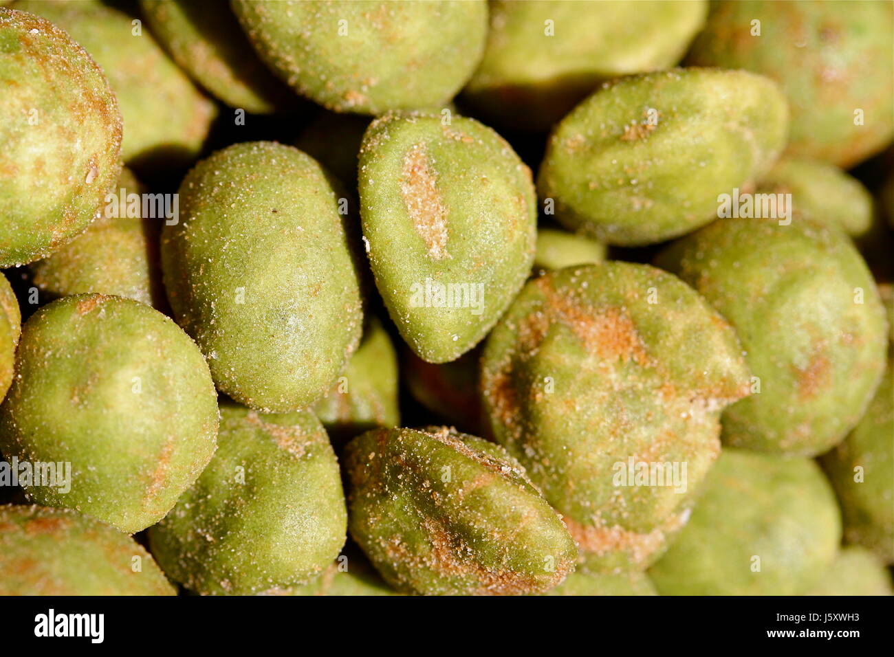 a heap of wasabi nuts Stock Photo - Alamy