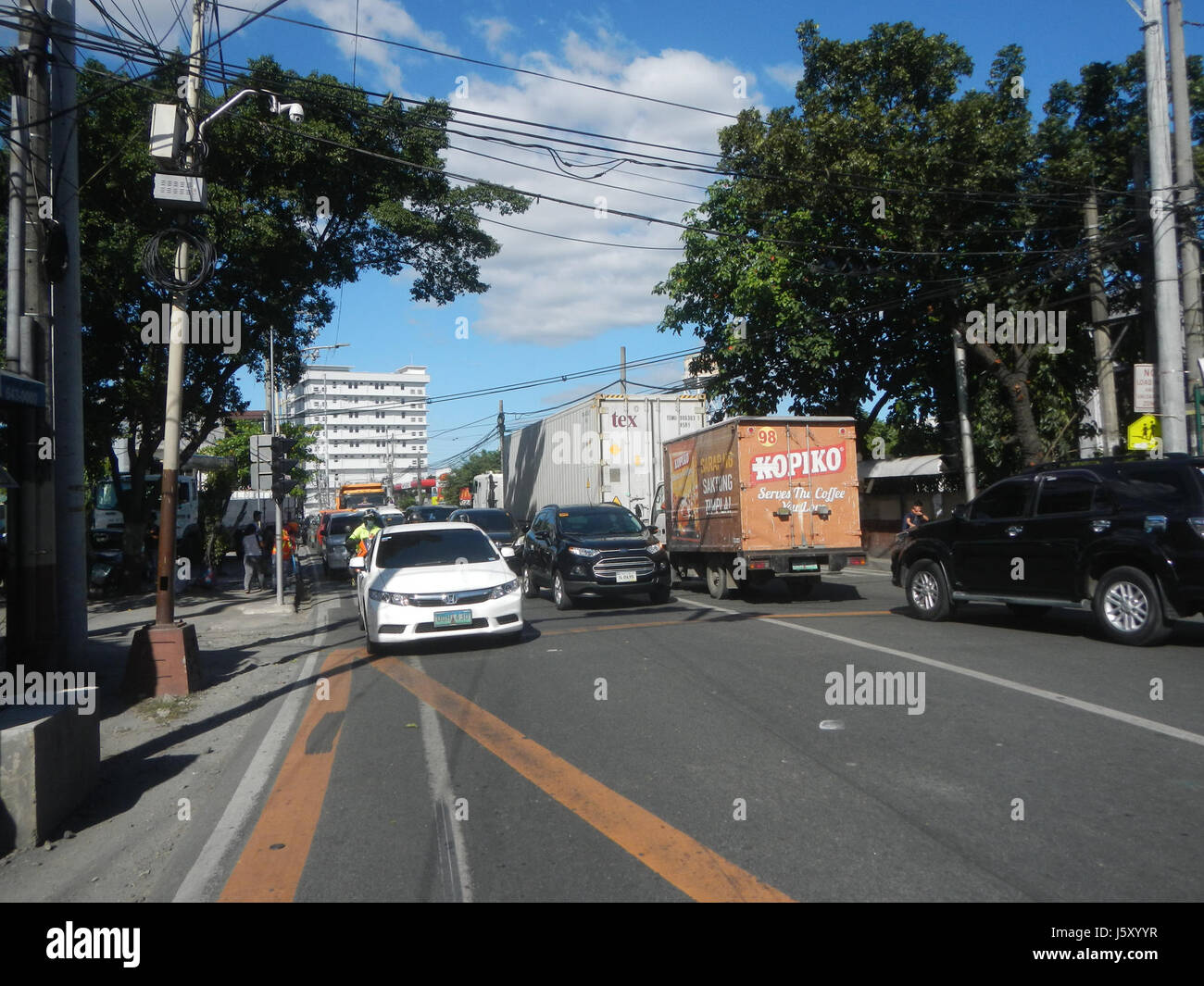 The image shows a bustling area in Pasig City, Philippines ...