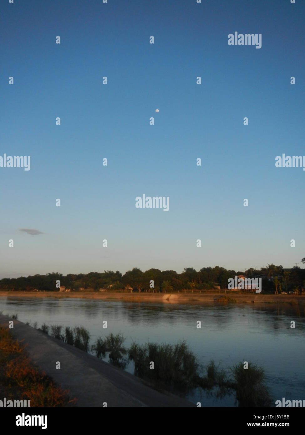 This image depicts the construction of riprap slope protection along ...