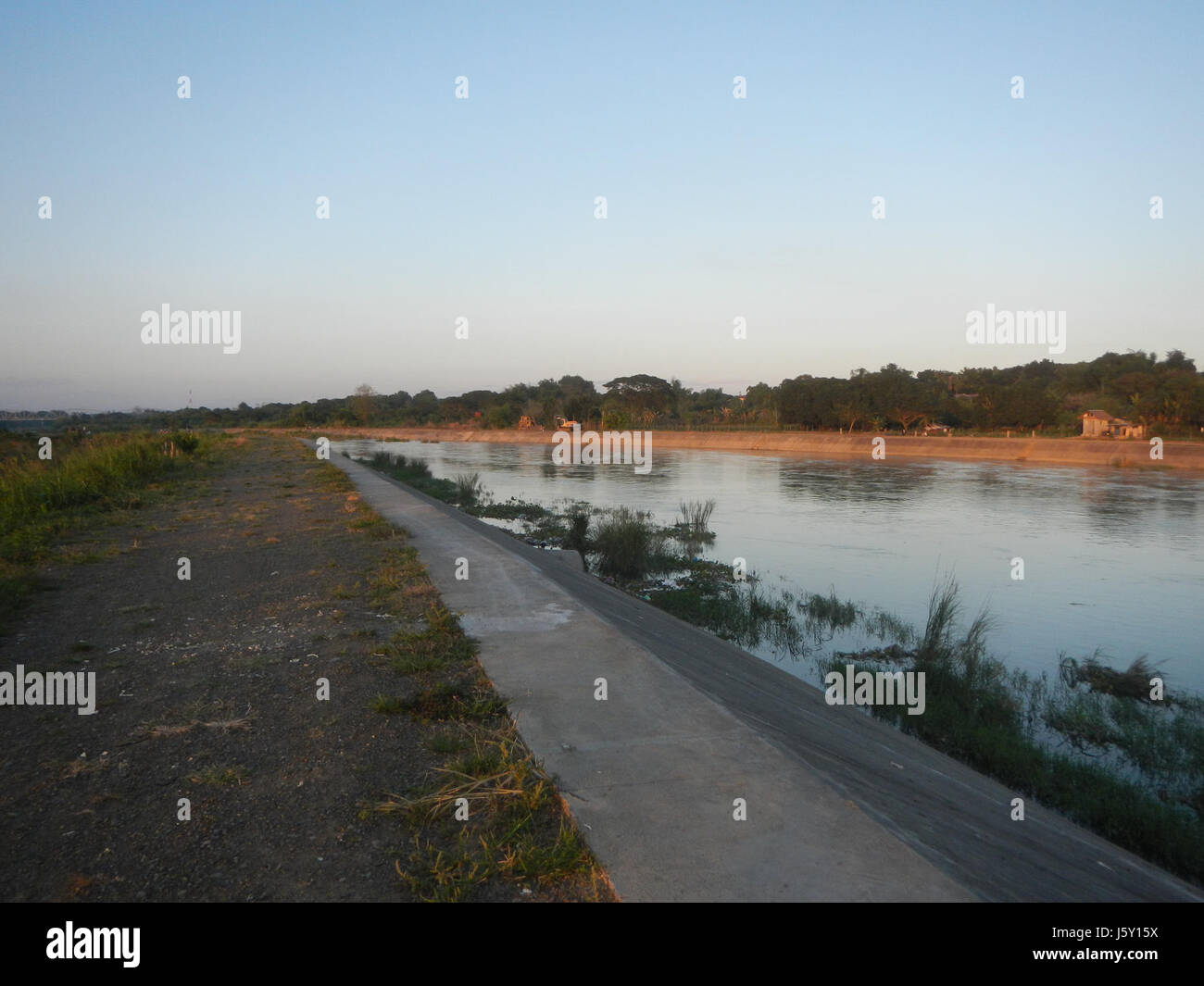 This photograph captures riprap construction used for slope protection ...